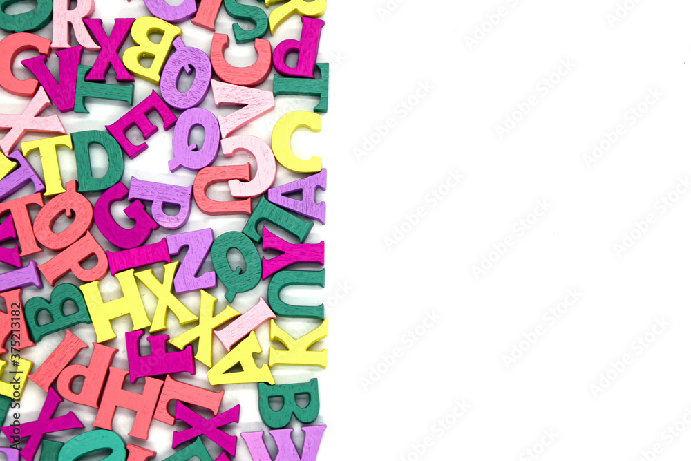 Multicolored background of wooden letters of the Latin alphabet with ...