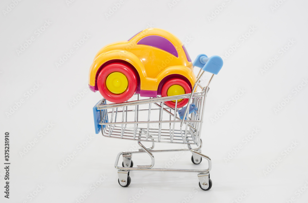 car in a shopping cart on white. Financial concept. car sale and ...