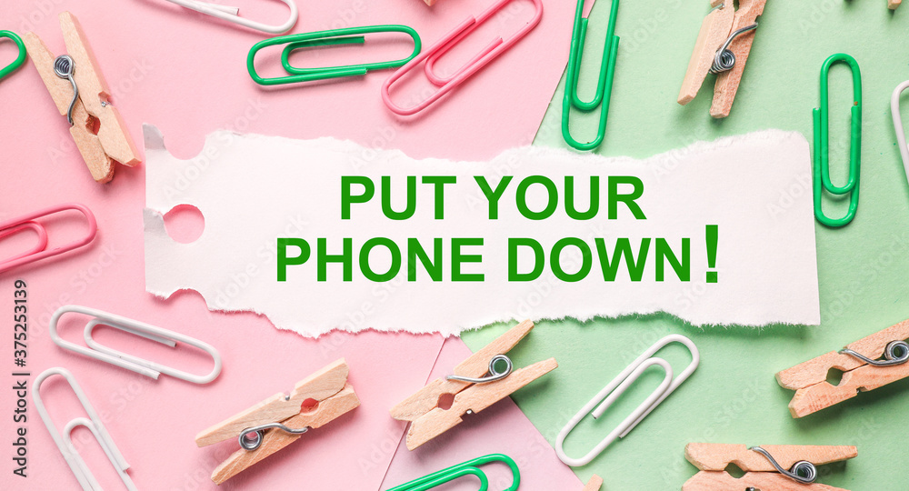Put down your phone. text on torn paper. Business concept. end of ...