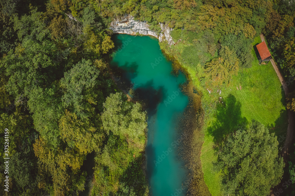Aerial drone view of river source or spring of Krupa in Bela Krajina ...