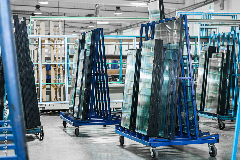 Production of plastic windows. On special trolleys for transportation ...