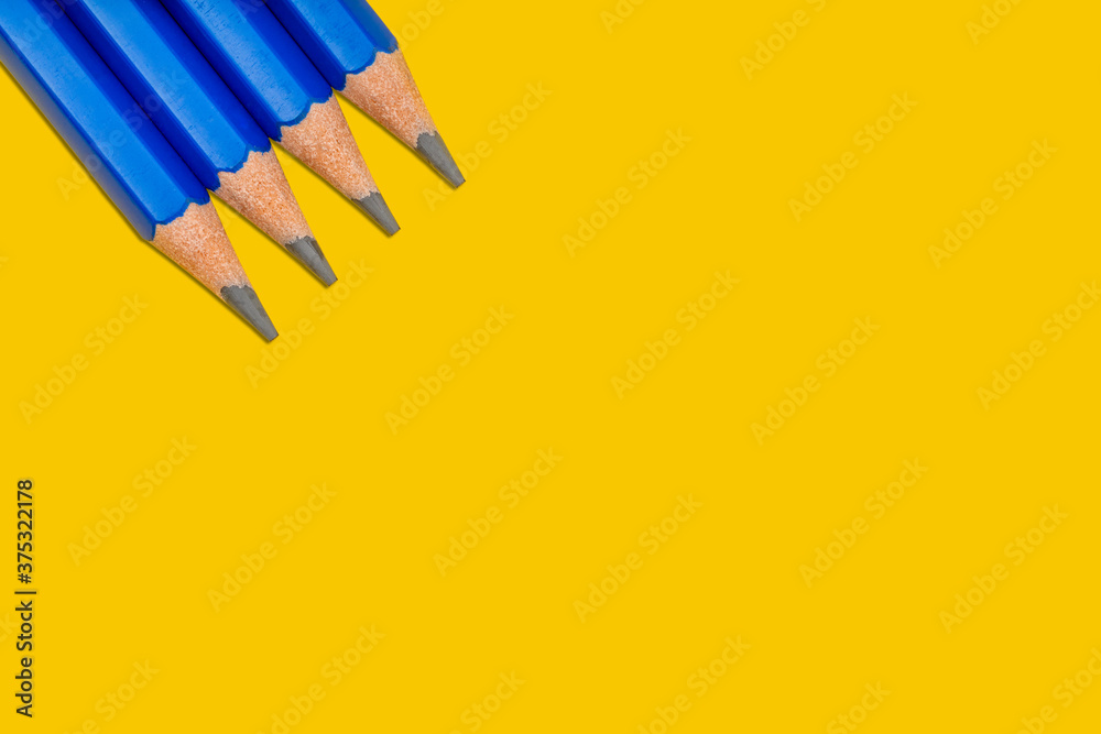 Yellow school background with blue pencils Stock Photo | Adobe Stock