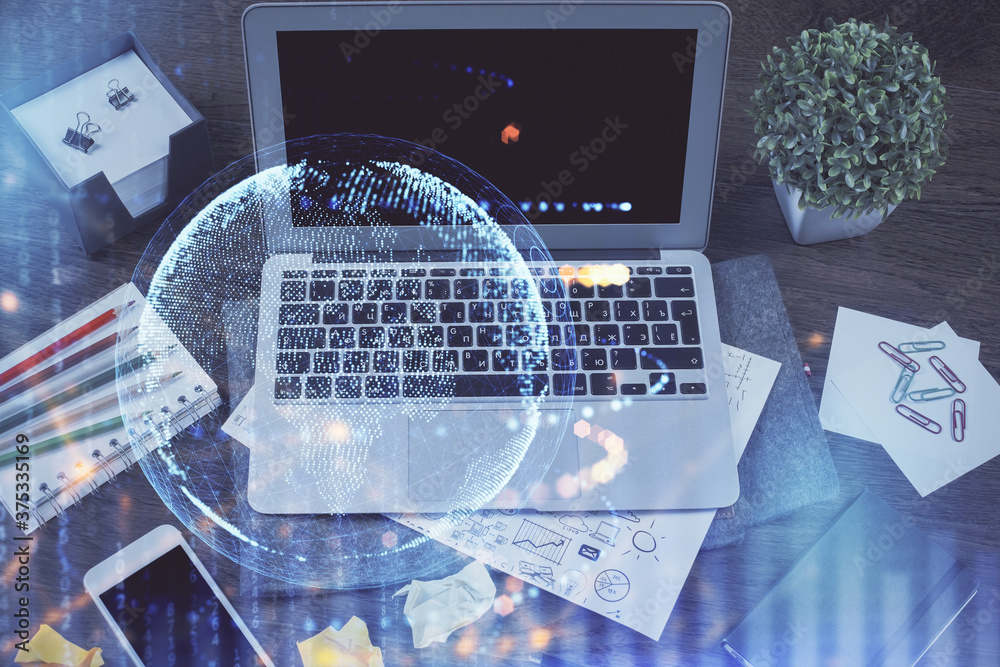 Multi exposure of table with computer and world map hologram ...