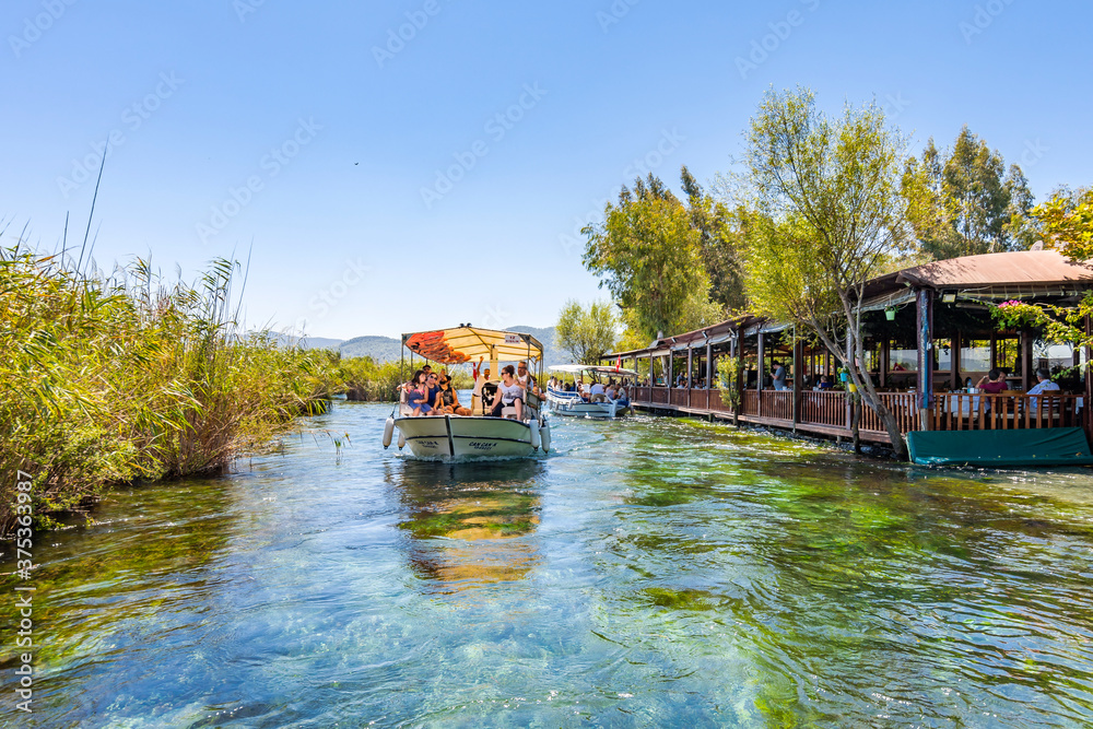 Taking tour on Azmak Stream in Akyaka Village. Akyaka is popular ...