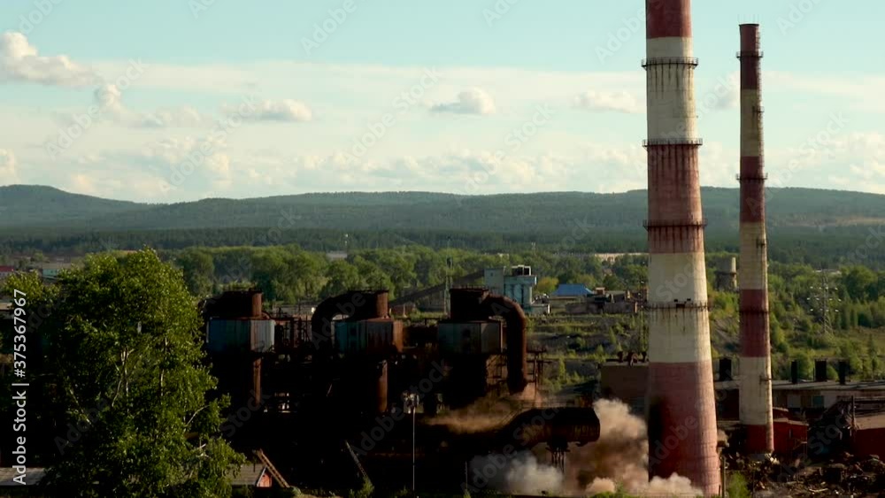 Explosive detonation of the base of the chimney. The collapse of an ...
