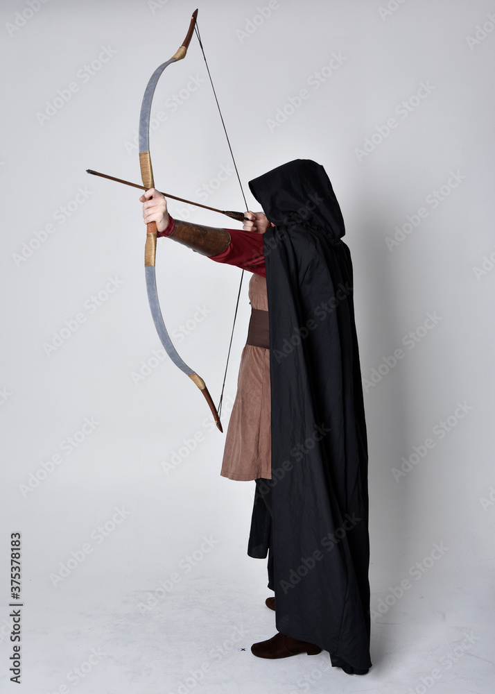 Fotografia do Stock: Full length portrait of girl with red hair wearing ...