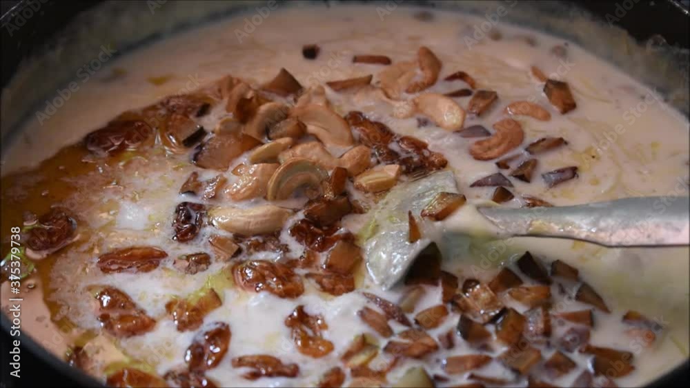 Preparing onam special Payasam with roasted dry fruits on top. Semiya ...