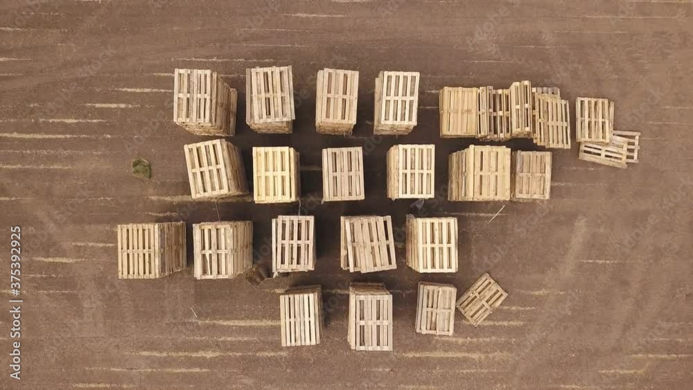 Top down shot of wooden pallets stack in the warehouse. Pile of ...