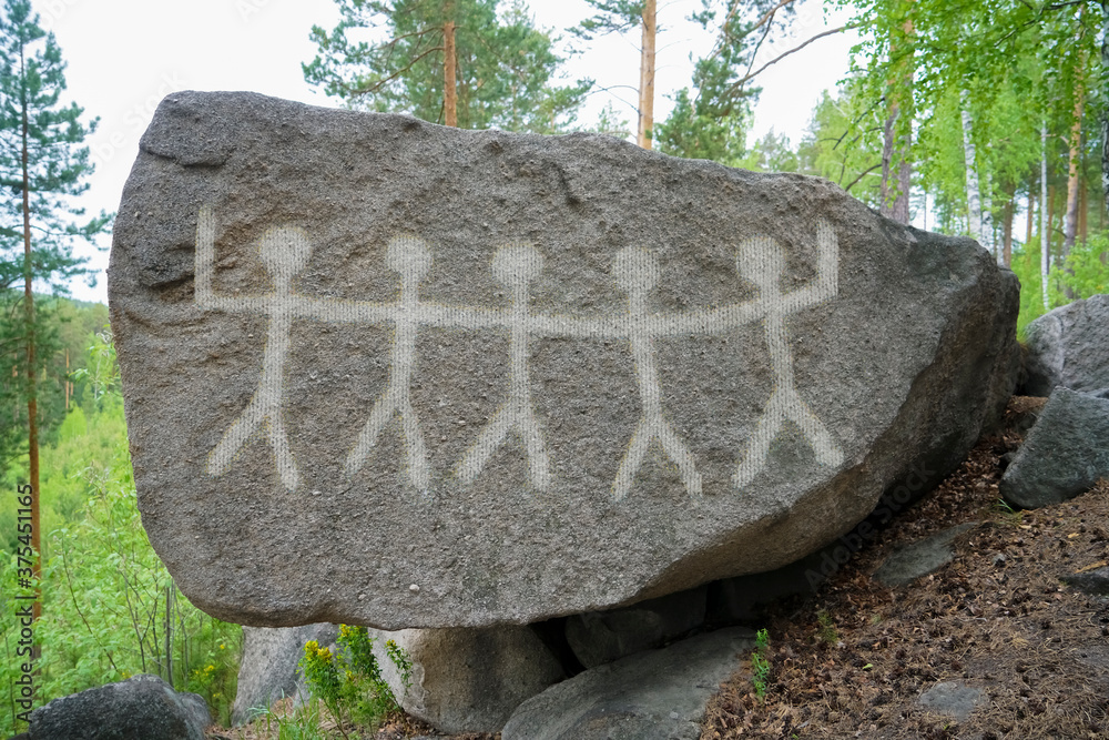 an ancient man, an image of ocher on the wall of rocks. Ancient ...