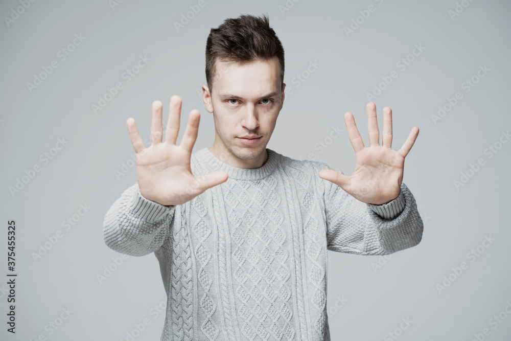 a young man with dark hair, a student of European appearance, shows a ...