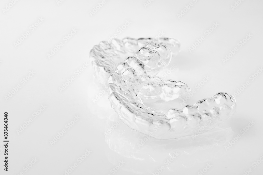 Two Invisible dental teeth aligners on the white background ...