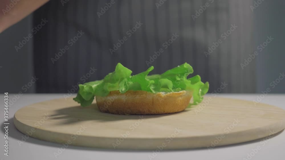 plastic pollution concept - male farmer cooking hamburger with empty ...