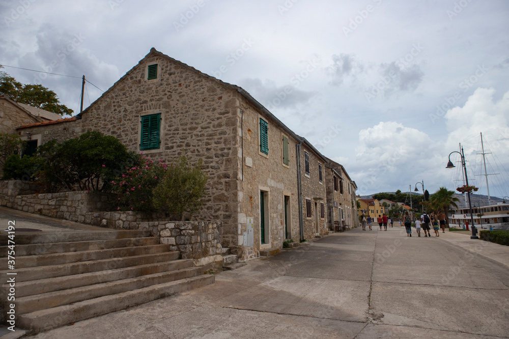 Stari Grad/Croatia-August 7th,2020: Old, stone houses by the waterfront ...