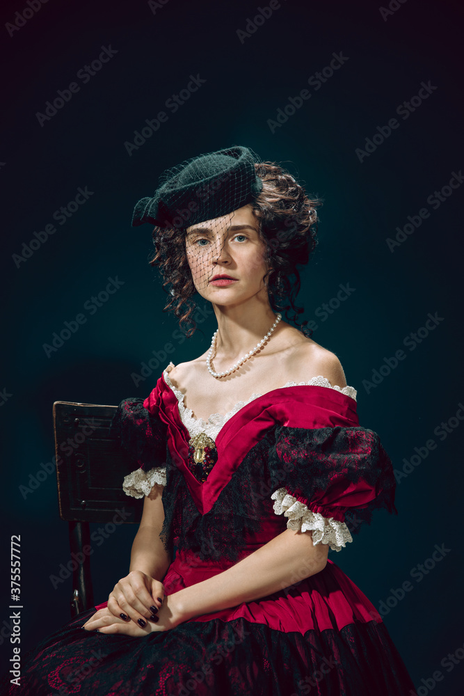 Love tragic. Young woman as Anna Karenina isolated on dark blue ...