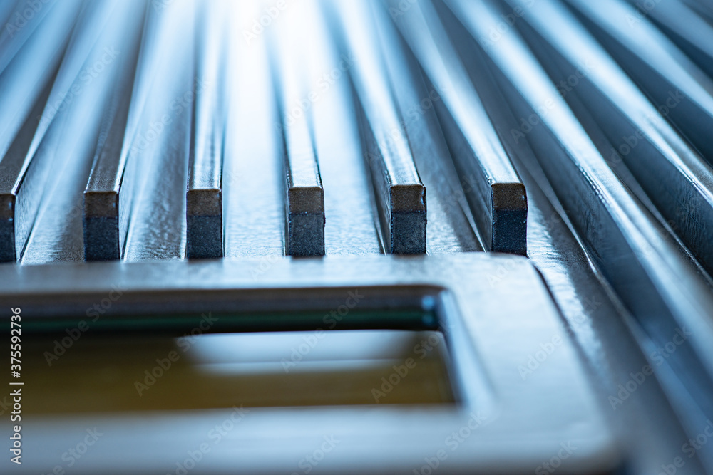 Fluted metal surface next to a control panel Stock Photo | Adobe Stock