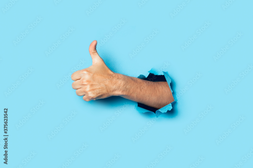 Male hand makes a hand up gesture on a blue background. Banner. Gesture ...