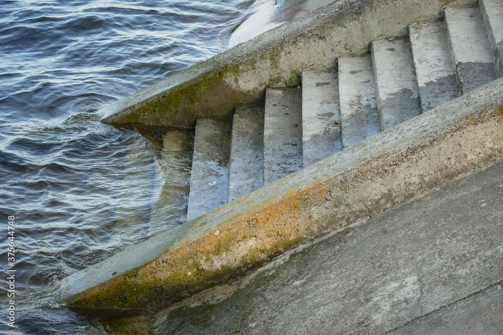 Concrete staircase underwater after flooding Stock Photo | Adobe Stock