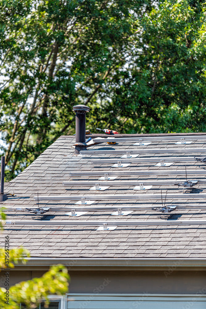 Stockfoto Rooftop installation work for solar panels racking mounted on ...