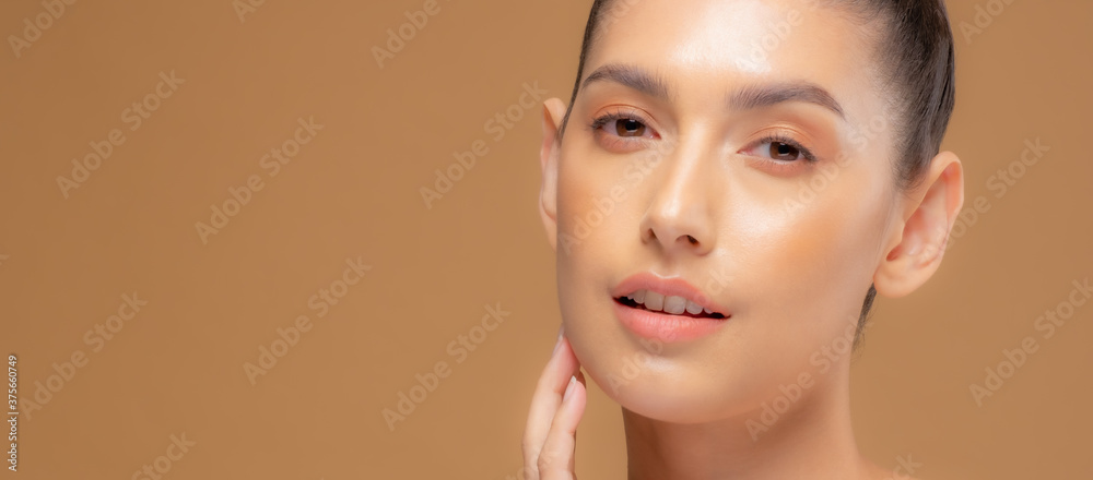 Beautiful woman with good skin taking pictures of face with hands ...