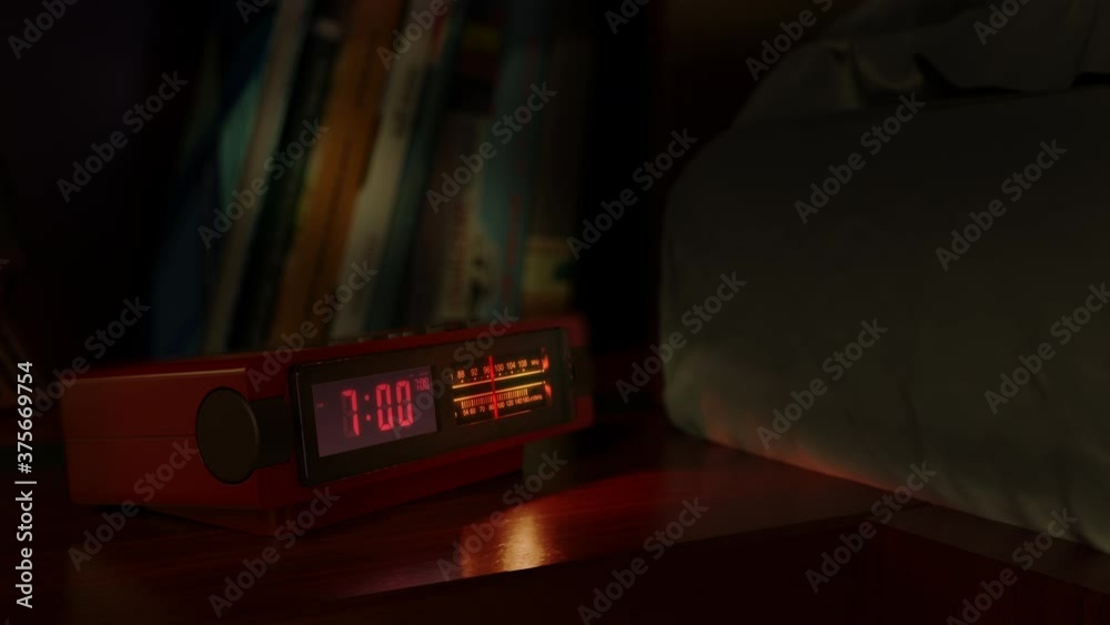 Vídeo do Stock: Vintage alarm clock with digital dial and radio waking ...