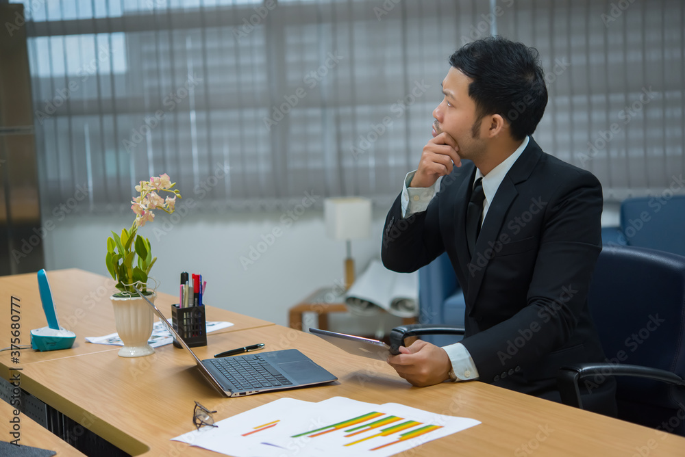 Asian handsom businessman working in the office,Thailand people ...