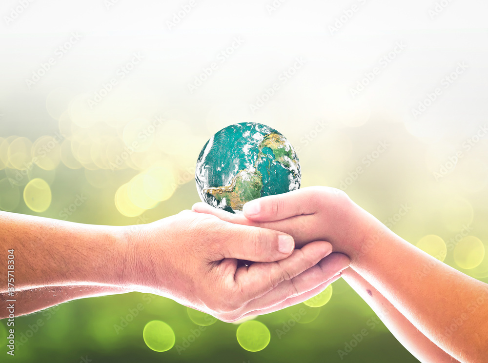 Earth day concept: Human hands holding earth global on blurred nature ...