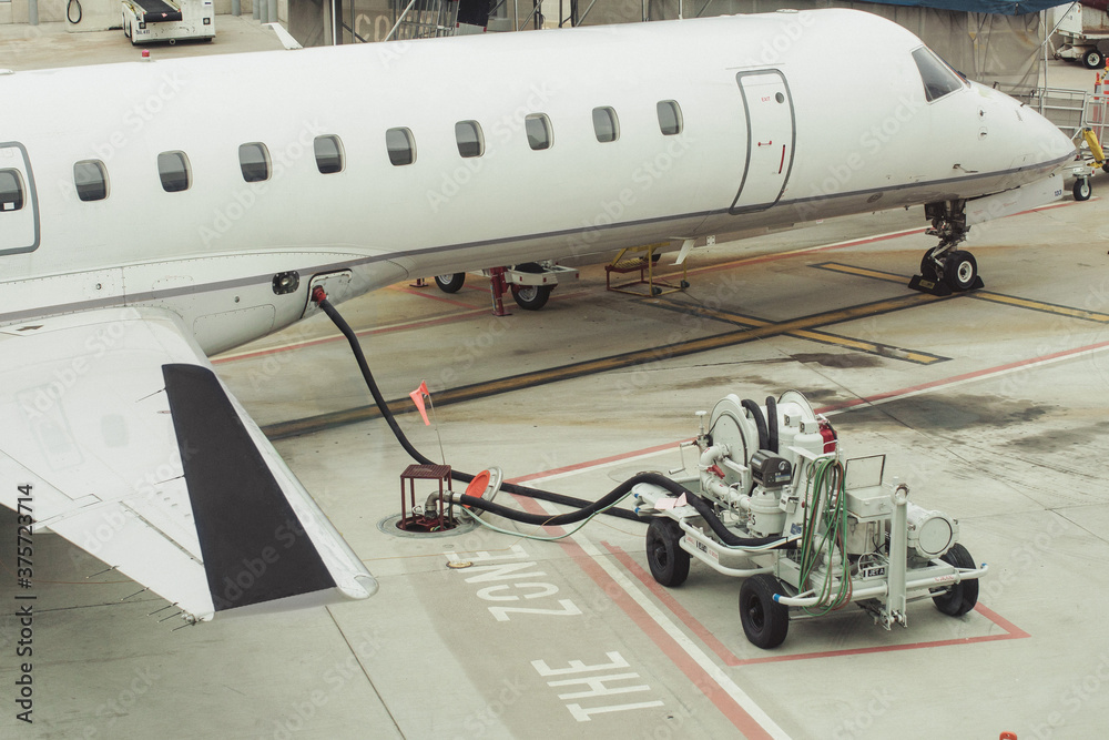 Refueling of commercial jet plane Stock Photo | Adobe Stock