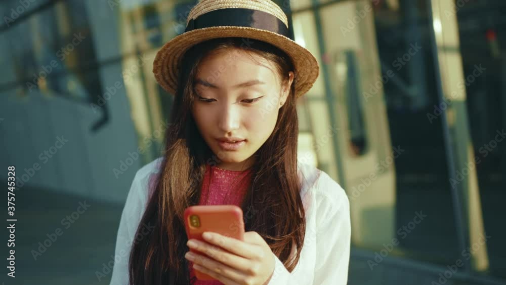 Cute chinese woman using cellphone communication device social media ...