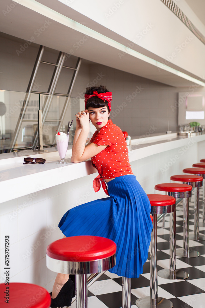 Pin up rockabilly female sitting at retro restaurant bar from 50's ...