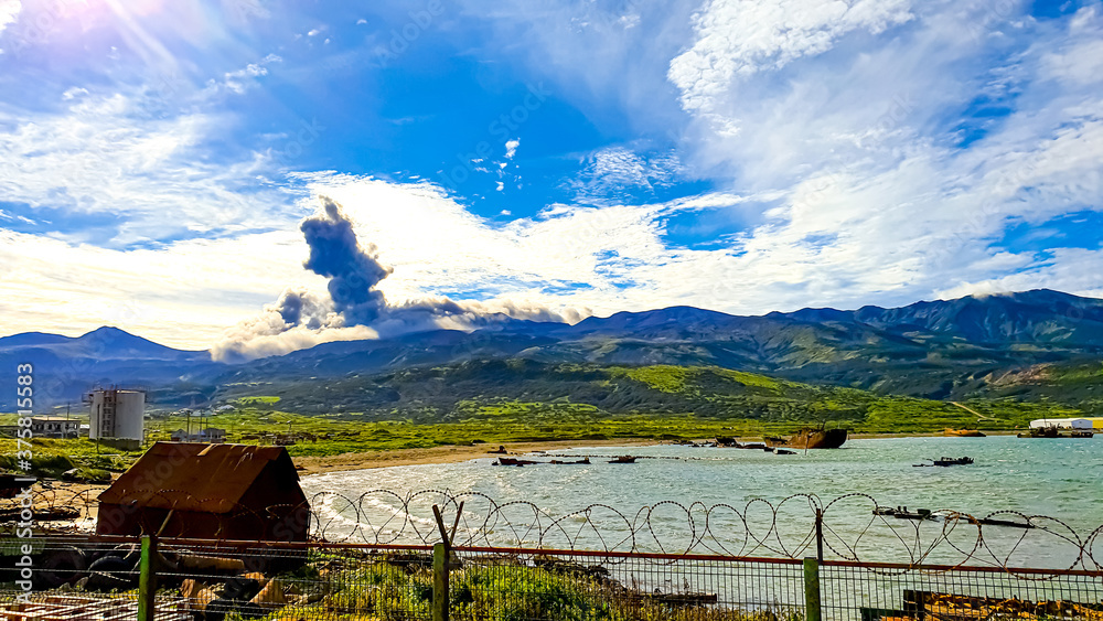 Landscape view with volcano eruption on the island of Paramushir, smoke ...