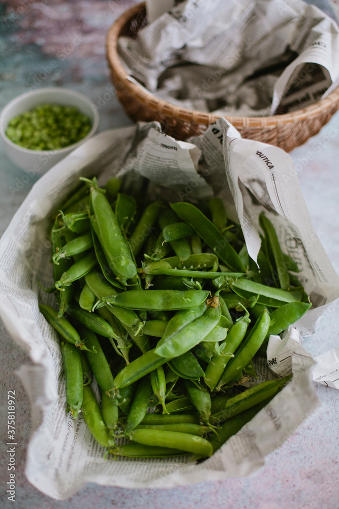 Pile of empty pea pods in newspaper Stock Photo | Adobe Stock