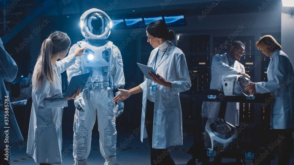 Diverse Team of Aerospace Scientists and Engineers Wearing White Coats ...