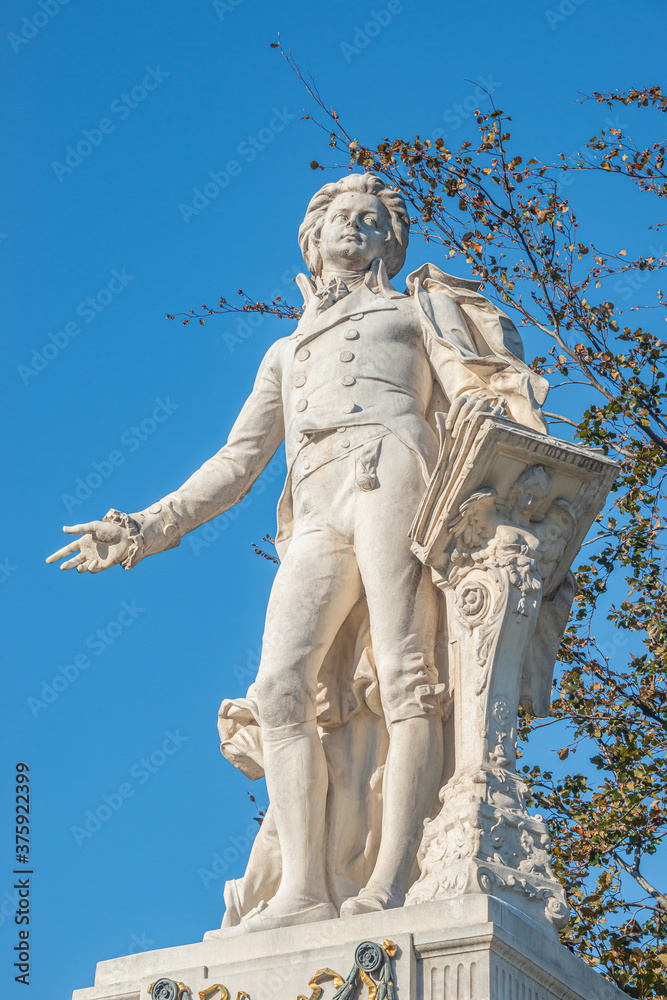 Warm sunset over Mozart monument in front of Palmenhaus, near Neue Burg ...