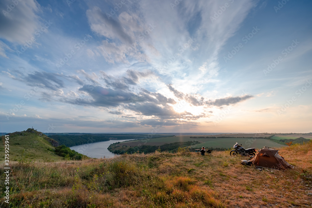 Camping at the top of the mountain. Wilderness. Motorcycle and tourist ...