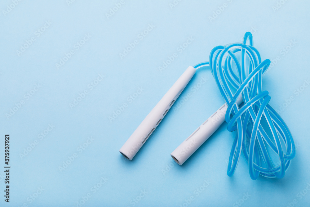 Jump rope on blue background with copy space, top view Stock Photo ...