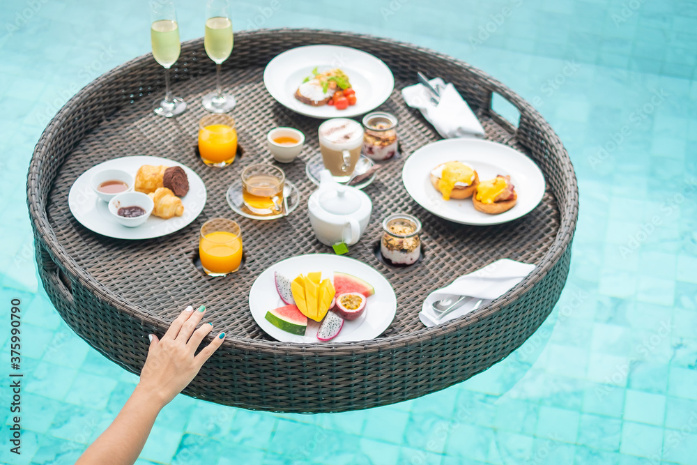 Floating Breakfast tray in swimming pool at luxury hotel or tropical ...