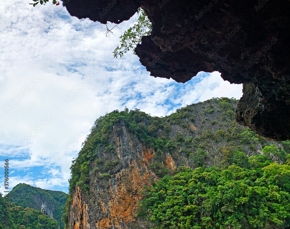 Beautiful Rocky Cliff with Trees Agaist Blue Sky with Fluffy Clouds ...