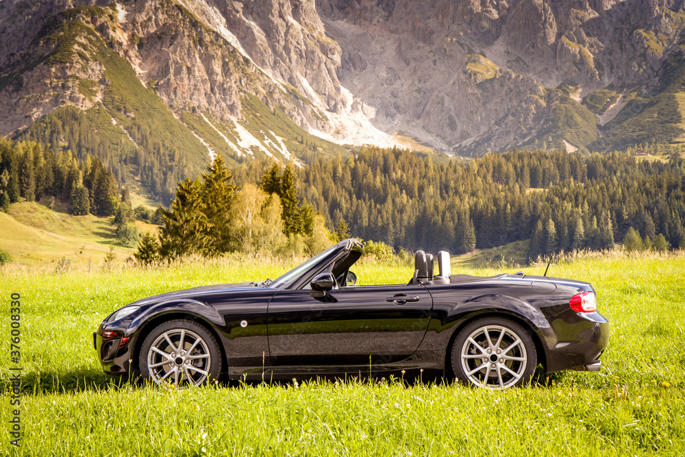Sports car (roadster Mazda MX-5, NC, NC2, NCFL, Miata) on alpine road ...