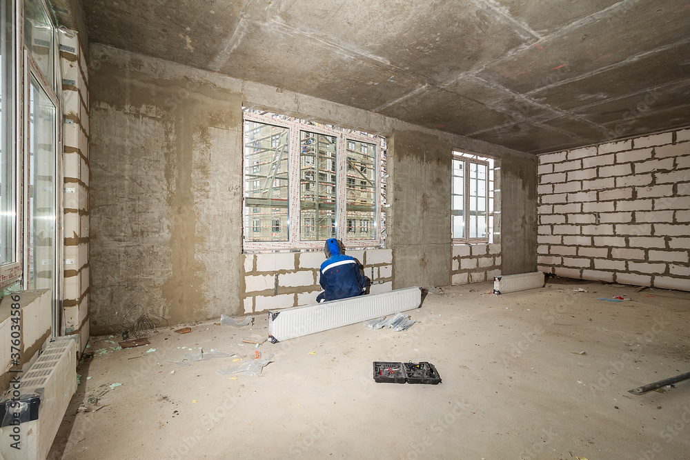 Drywall installation work in progress by construction workers at ...