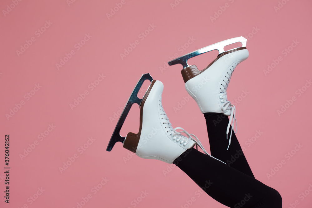 Figure skating is a winter sport and leisure. Women's feet in ice ...