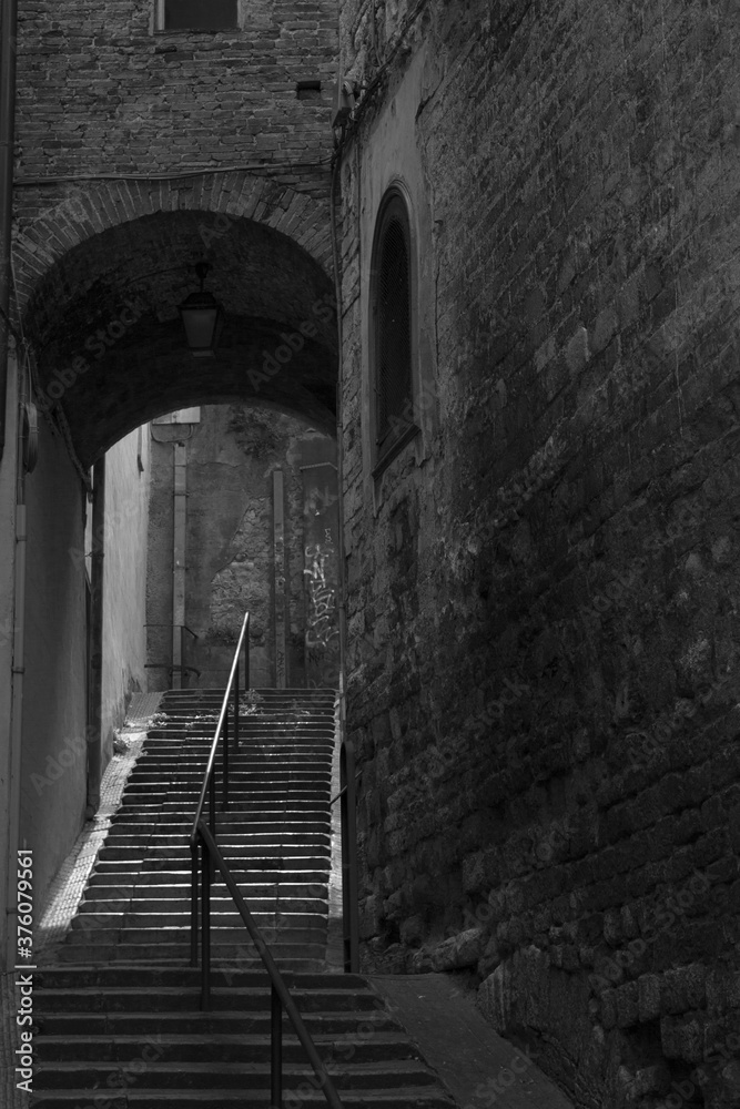 Ancient street in the historic center of a medieval city. Medieval ...