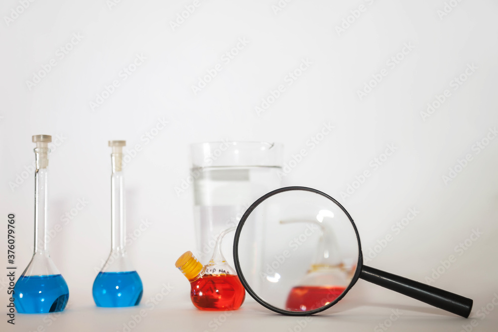 Group of flasks and test tubes in chemical laboratory. Reagents and ...