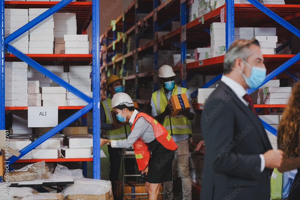 Manager with worker team working warehouse. During working hours in the ...