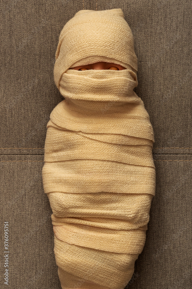 The man is wrapped in a cloth. The body is shrouded in a veil. The ...