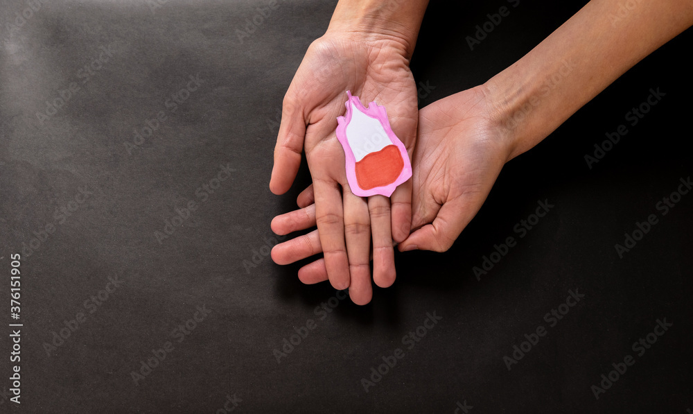 Hands holding a drop of blood, blood donation, blood transfusion, world ...