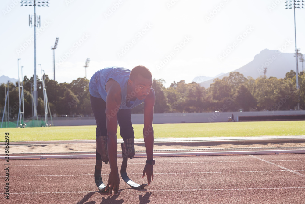 Black African American Male athlete with prosthetic leg performing ...