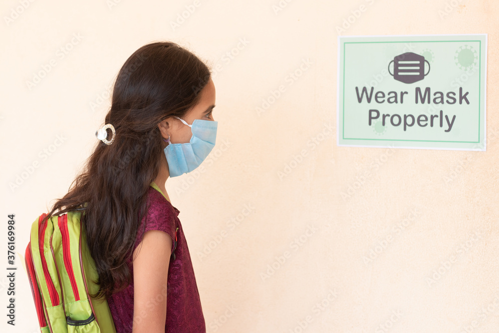 Young girl Student adjusting mask by seeing wear mask properly notice ...
