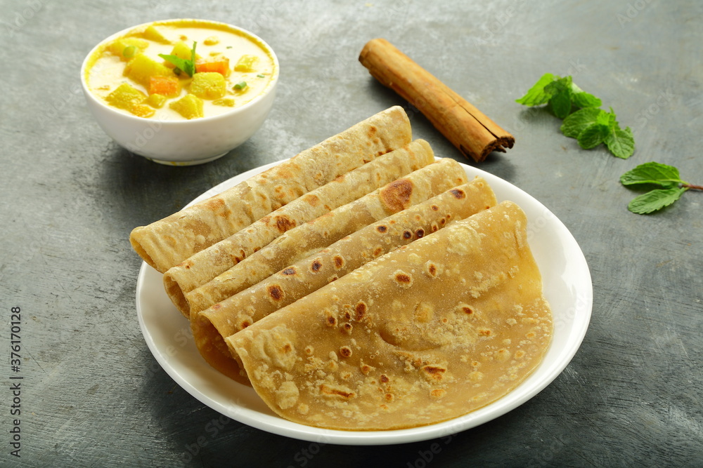 Top view- Indian street foods background- chapathi or chapati served ...