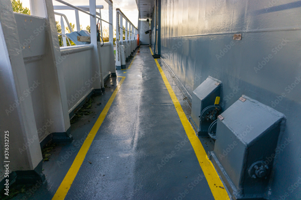 Safety walkway on ships deck. Yellow line walkway. Guided walkway on ...