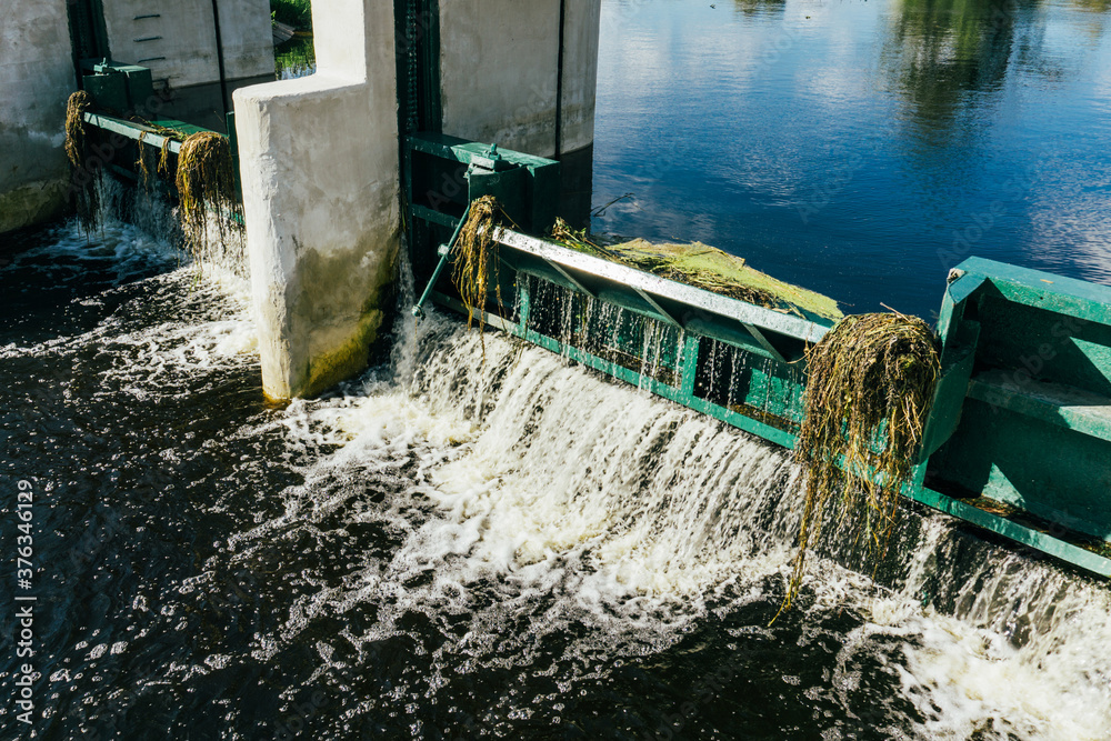 Water dam on a river. Water level regulation. Environment industry ...